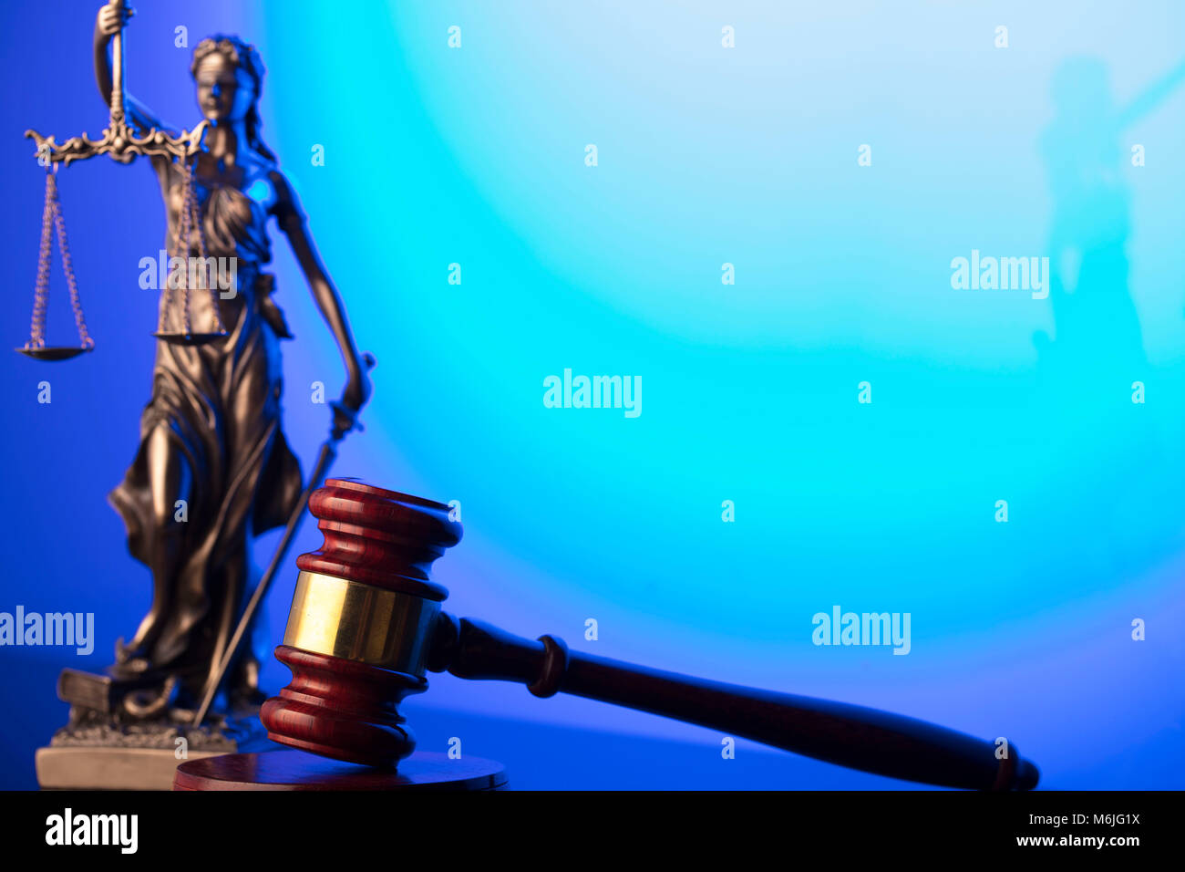 Lady of justice - Themis statue on blue background. Place for text ...