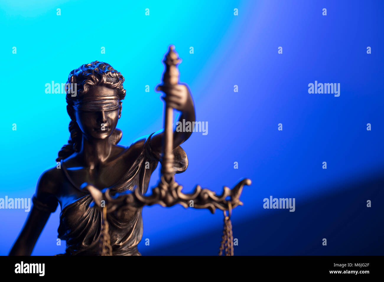 Lady of justice - Themis statue on blue background. Place for text ...
