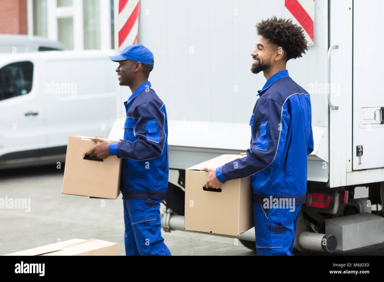 Delivery man loading up his vehicle hi-res stock photography and images ...