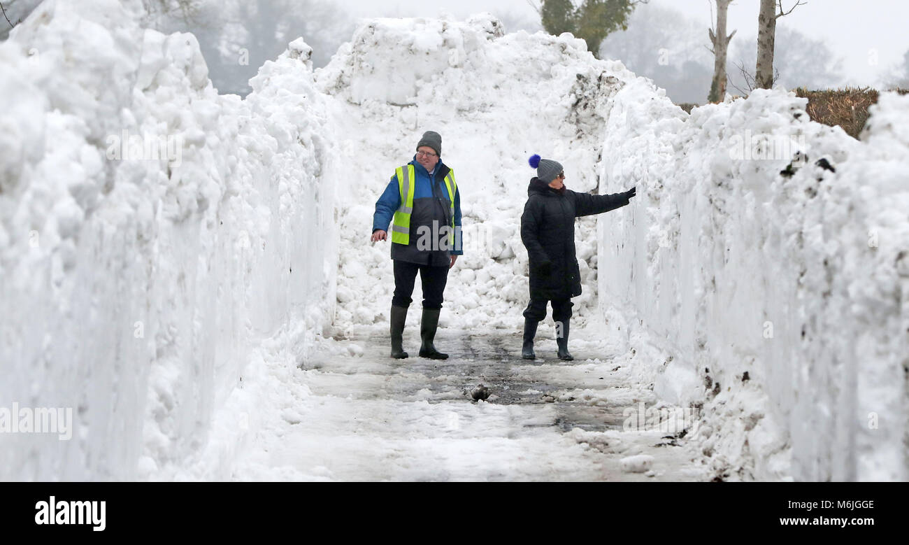 Brother and sister Seamus Ashe and Maureen Sammon look at a trench of ...