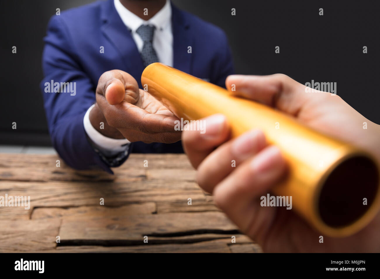 Person Passing A Relay Baton High Resolution Stock Photography and ...