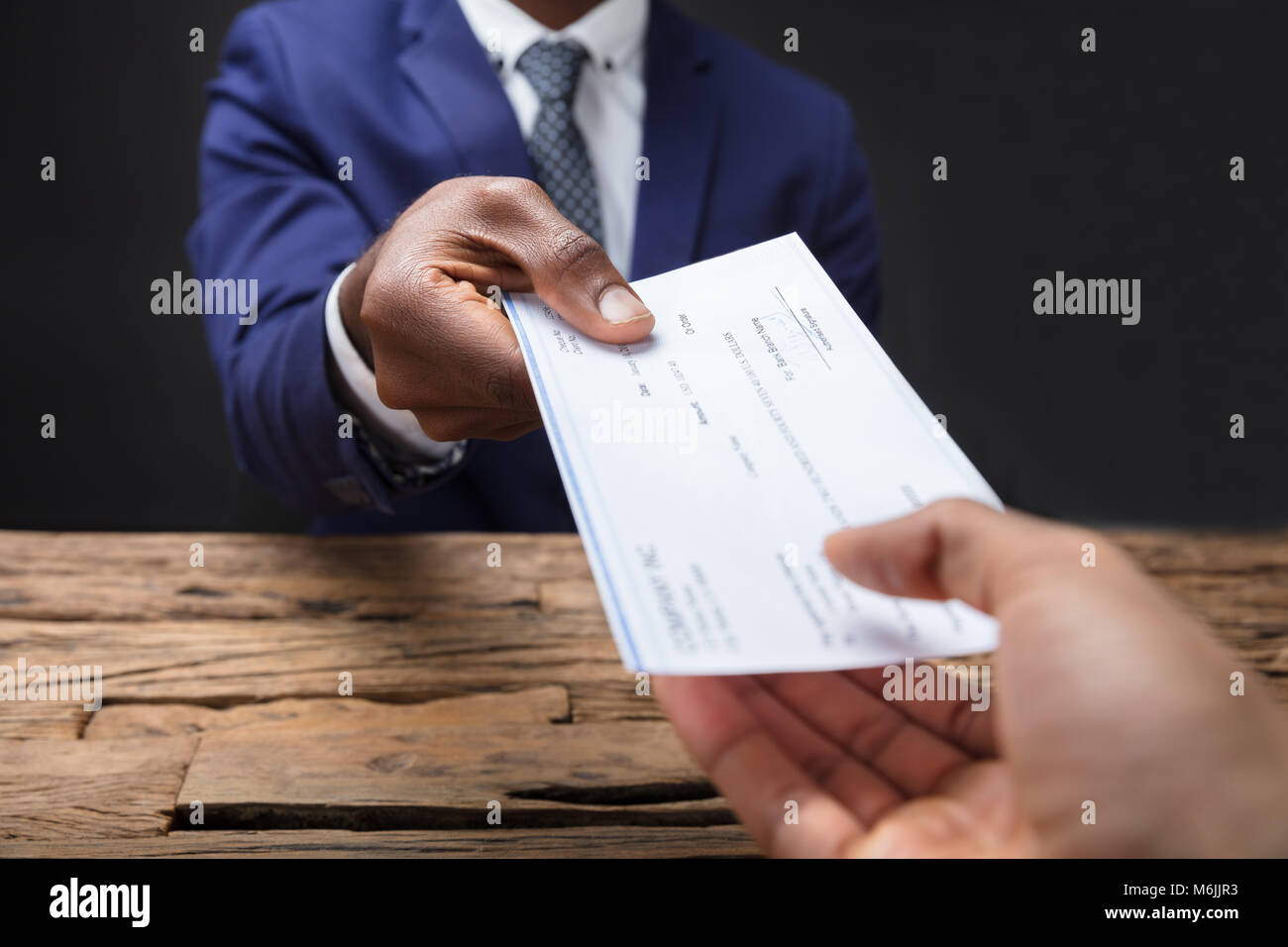 Team holding cheque hi-res stock photography and images - Alamy