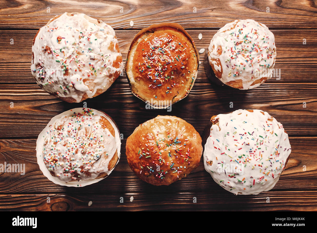 delicious easter bread cake with colorful icing top view on wooden ...