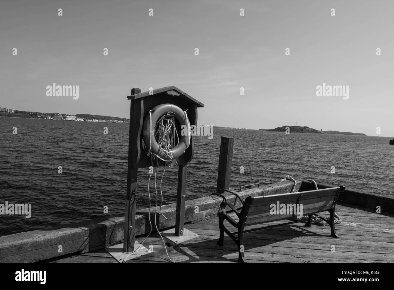 Black and white picture sea front with bench and life ring Halifax Nova ...