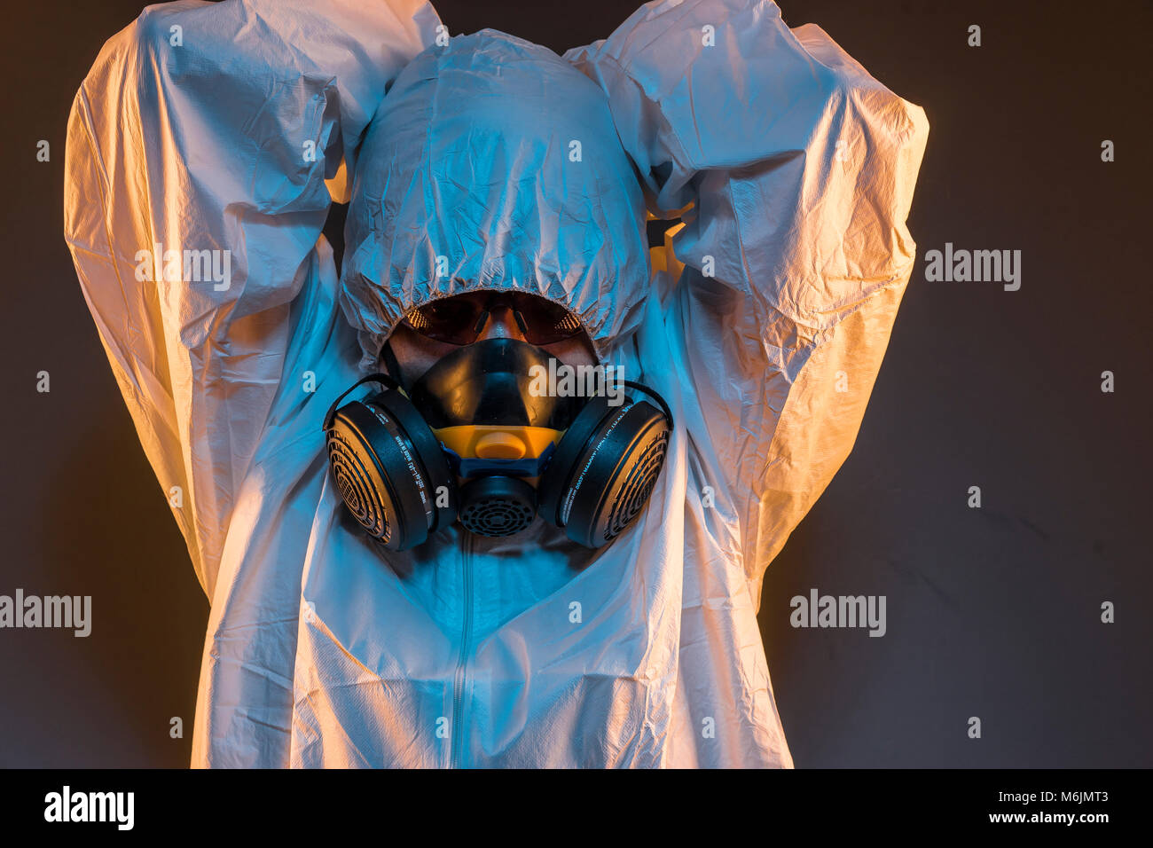 virus infection concept. Man in protective suit and antigas mask with ...