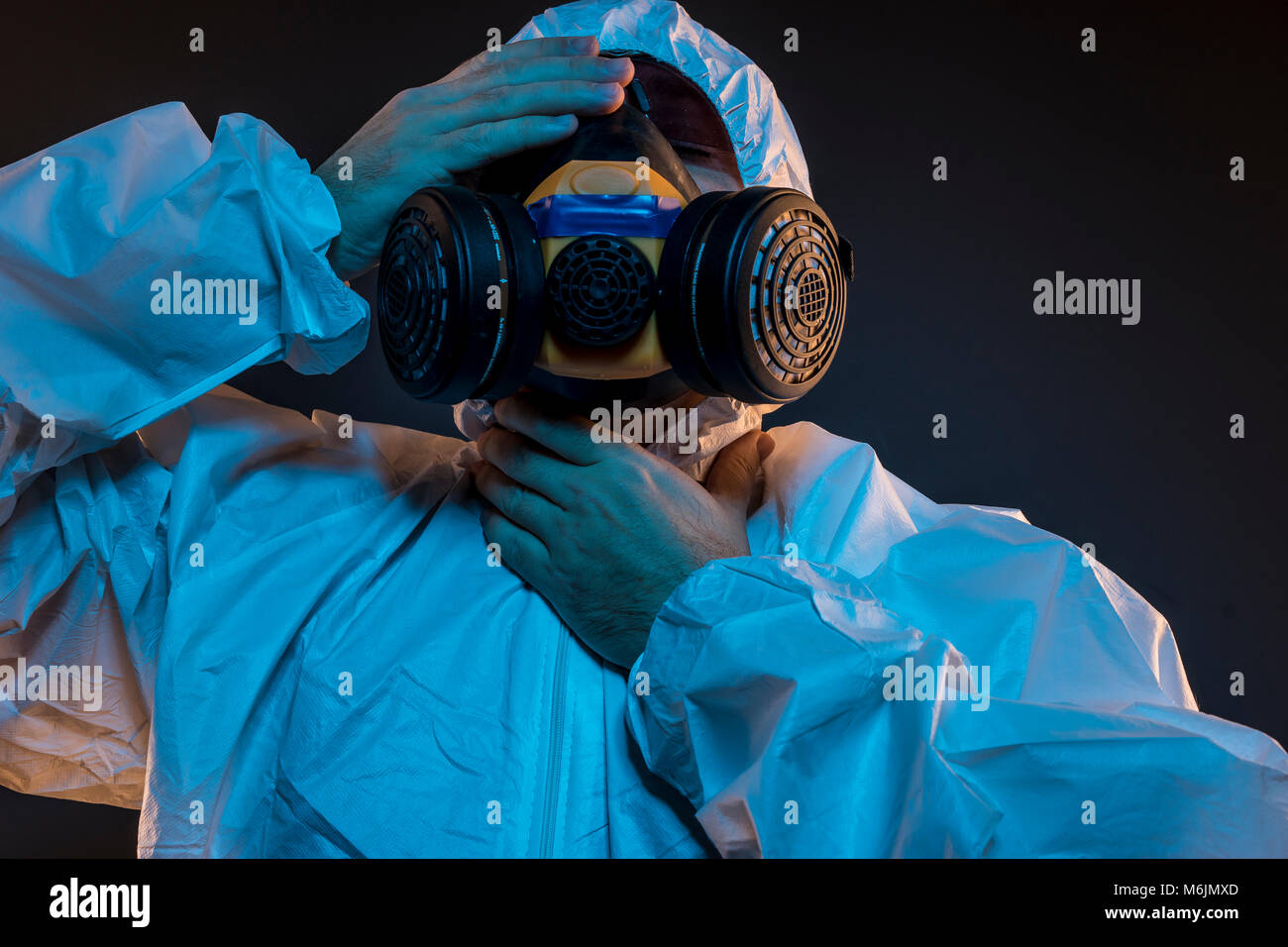 Safety virus infection concept. Man in protective suit and antigas mask ...
