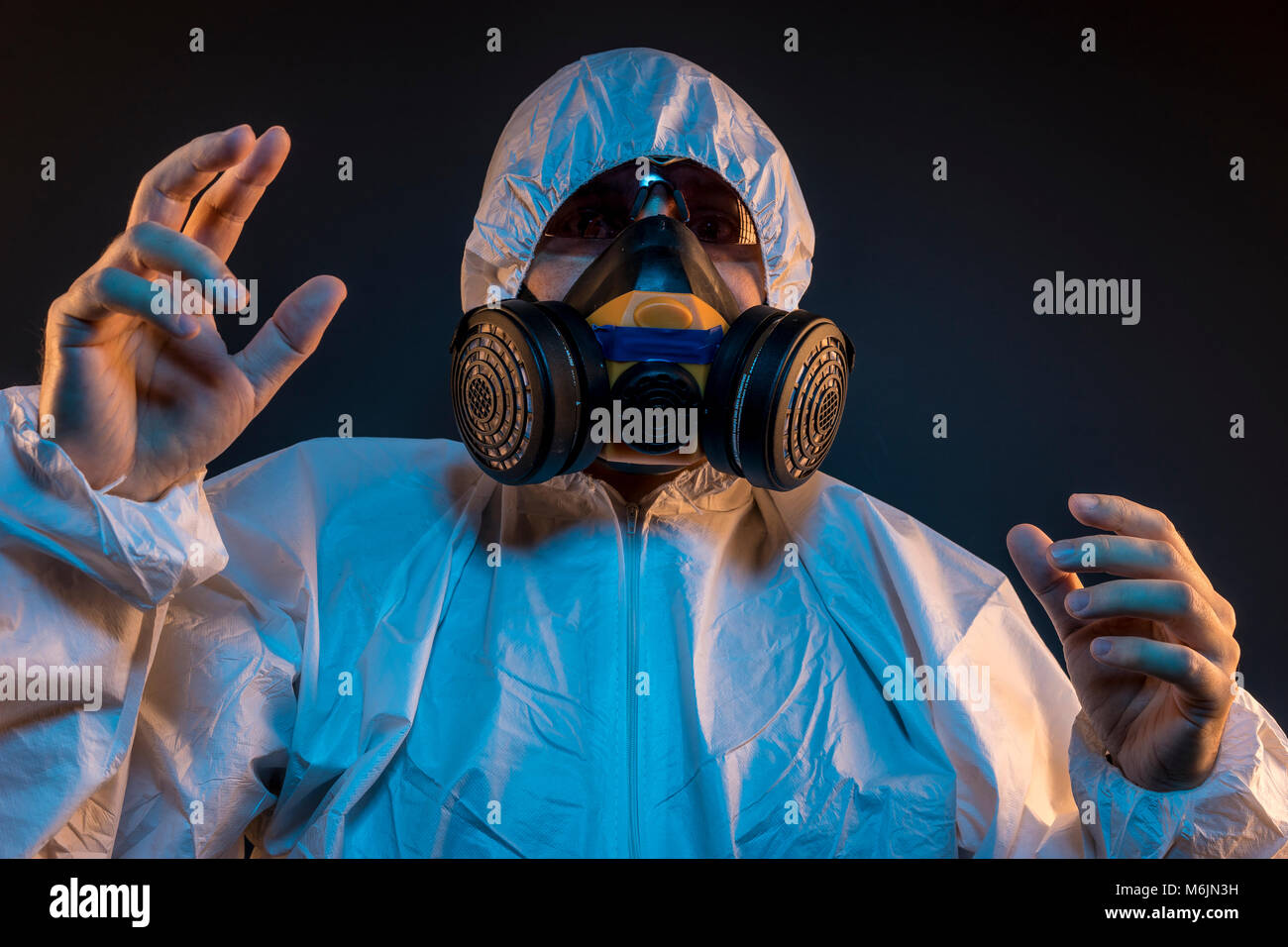 virus infection concept. Man in protective suit and antigas mask with ...