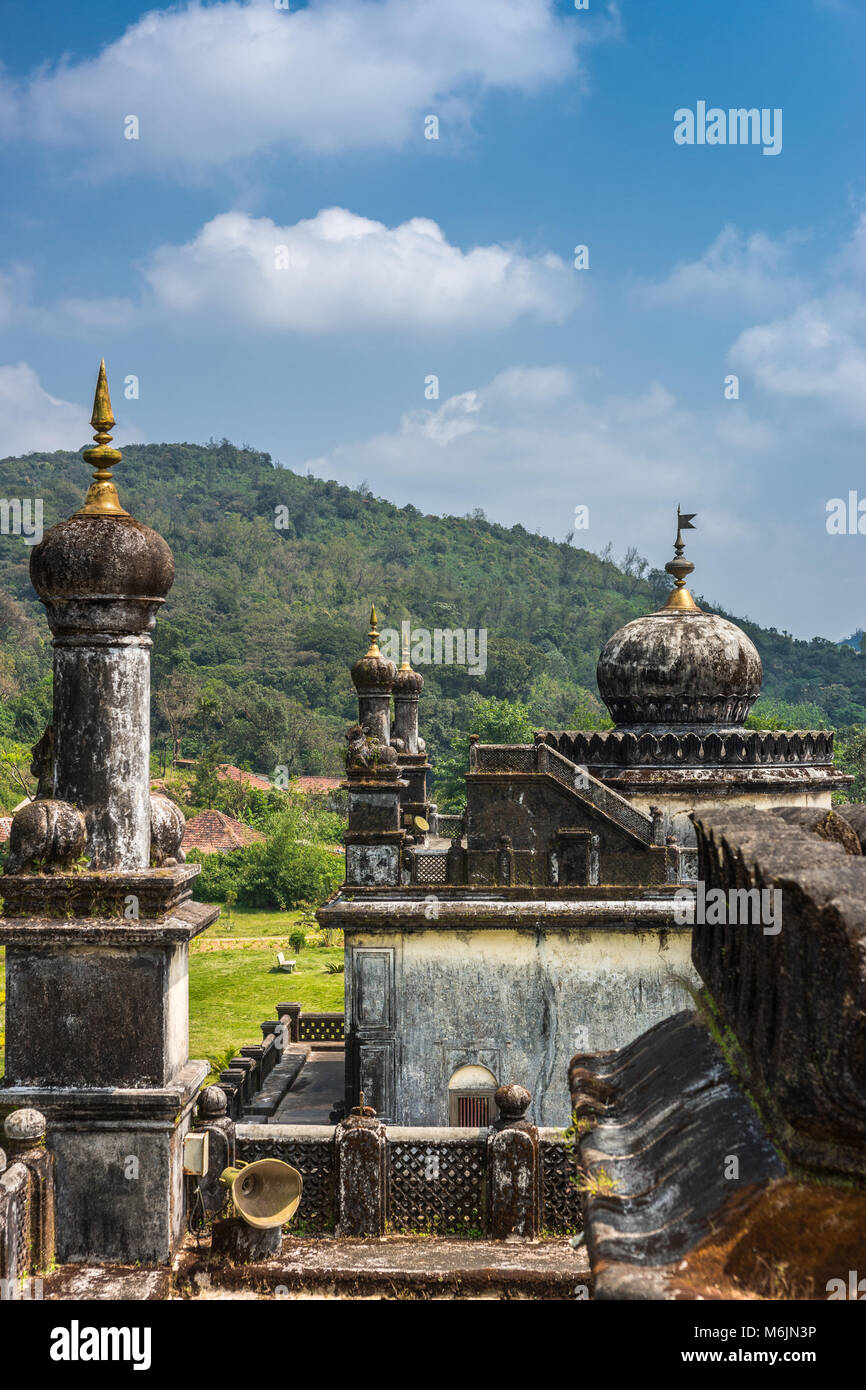 Madikeri, India - October 31, 2013: Domes, golden flags and turrets on ...