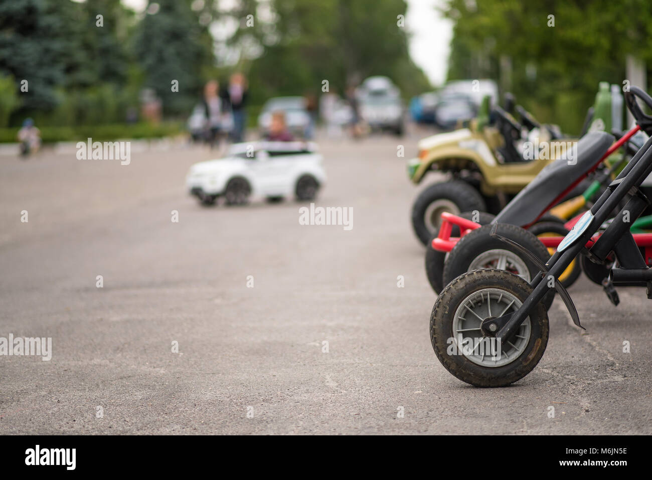 Car and bike rental, children's entertainment, summer Stock Photo - Alamy