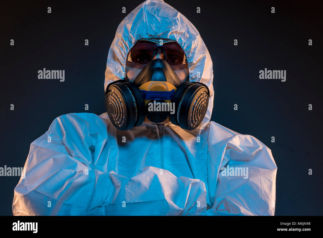 virus infection concept. Man in protective suit and antigas mask with ...