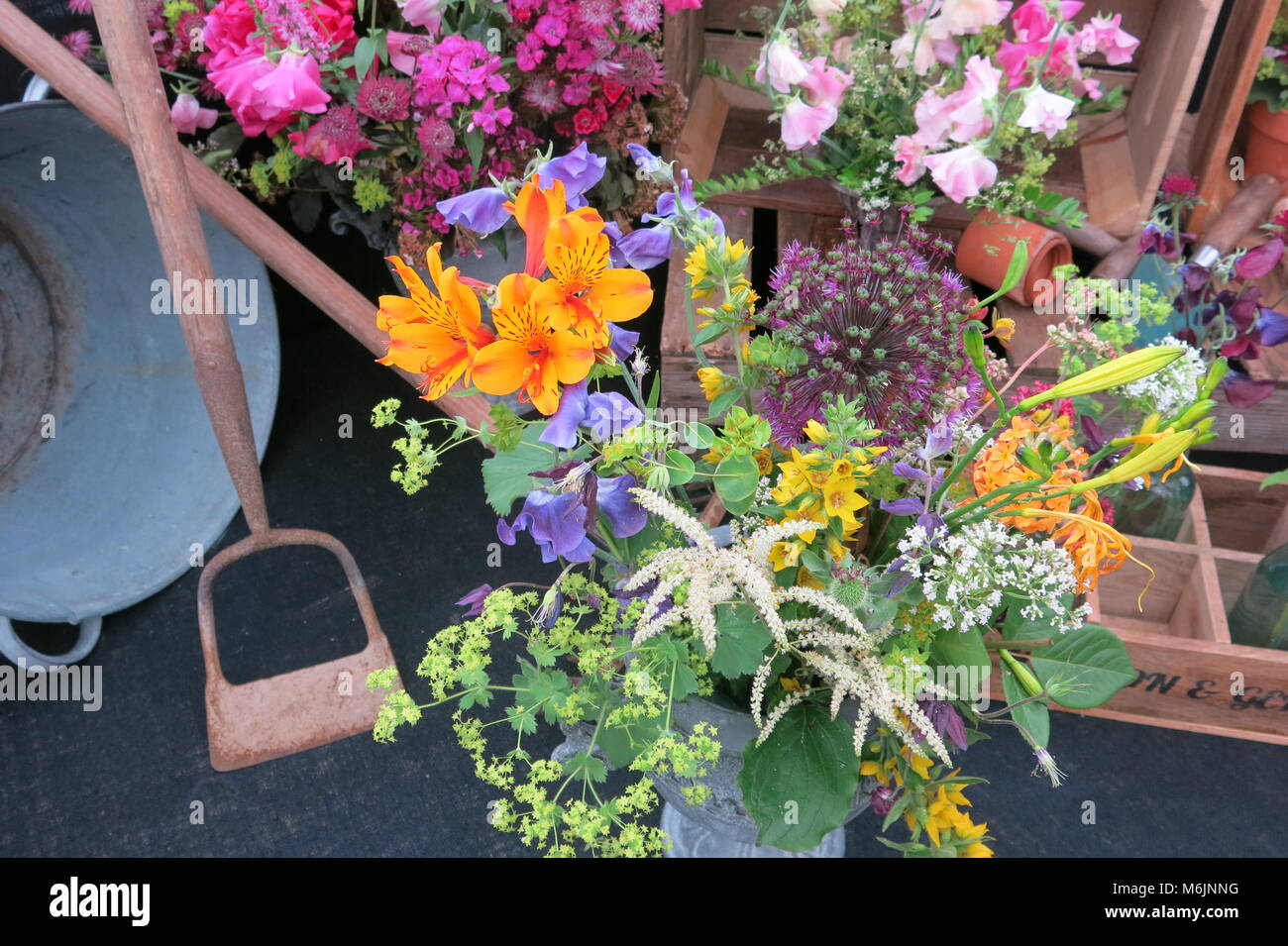 A colourful photo of summer flowers and garden paraphernalia Stock ...