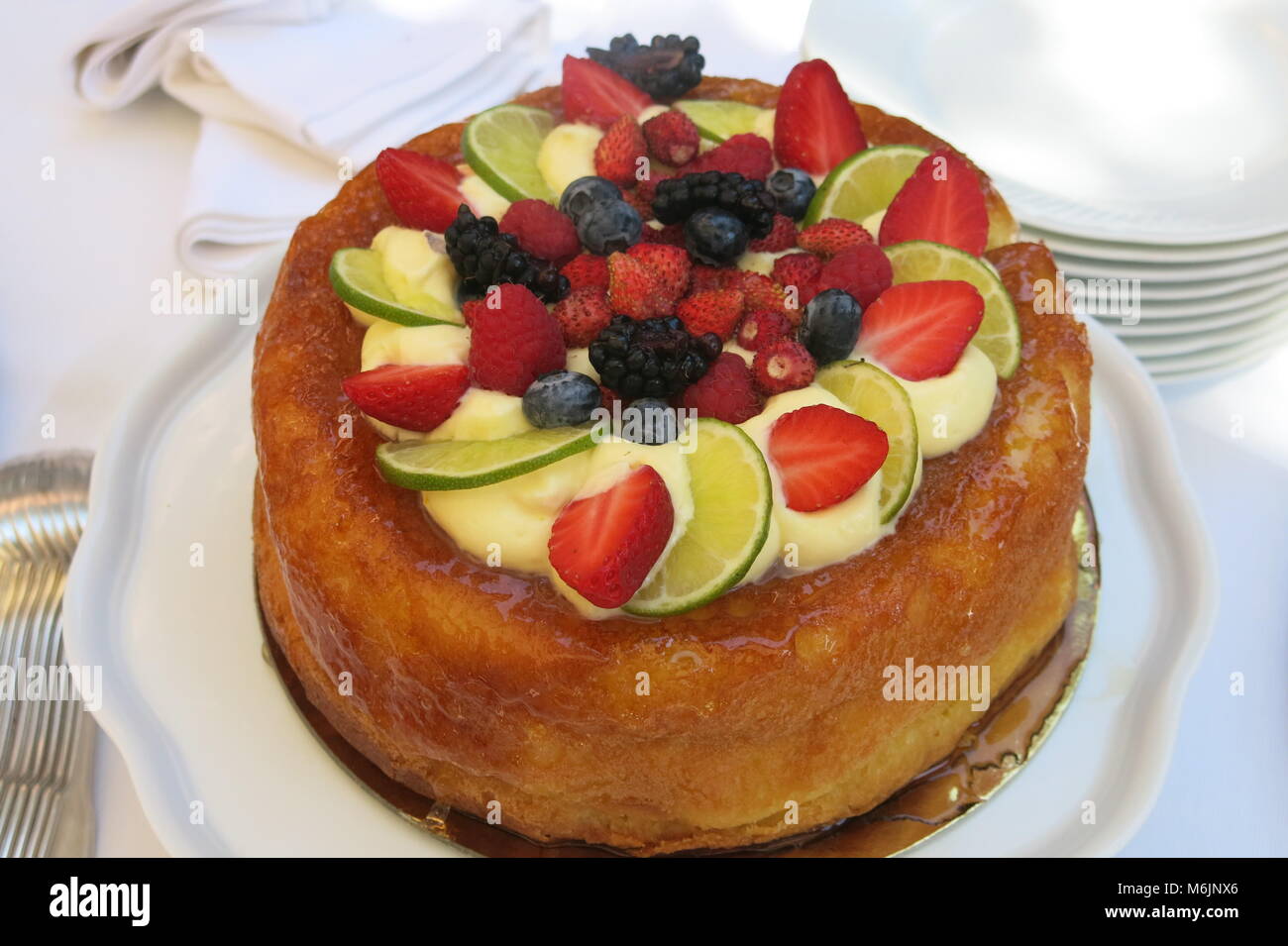 A mouth-watering Neopolitan speciality, a Rum Baba, decorated with ...