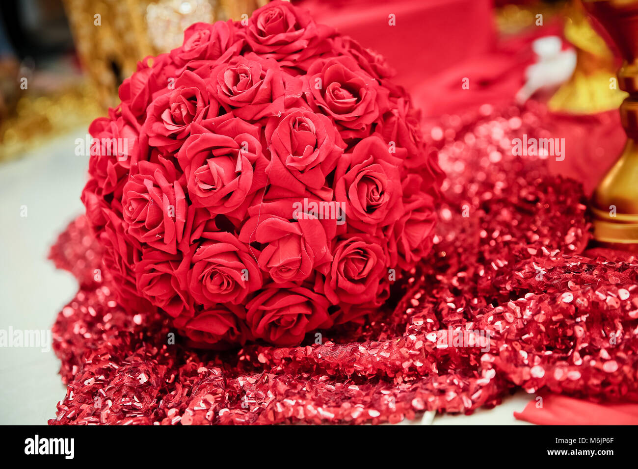 Round artificial red rose bouquet for engagement Stock Photo - Alamy