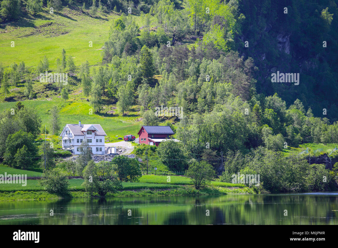 Beautiful spring landscape with silent lake, forest and mountains in ...