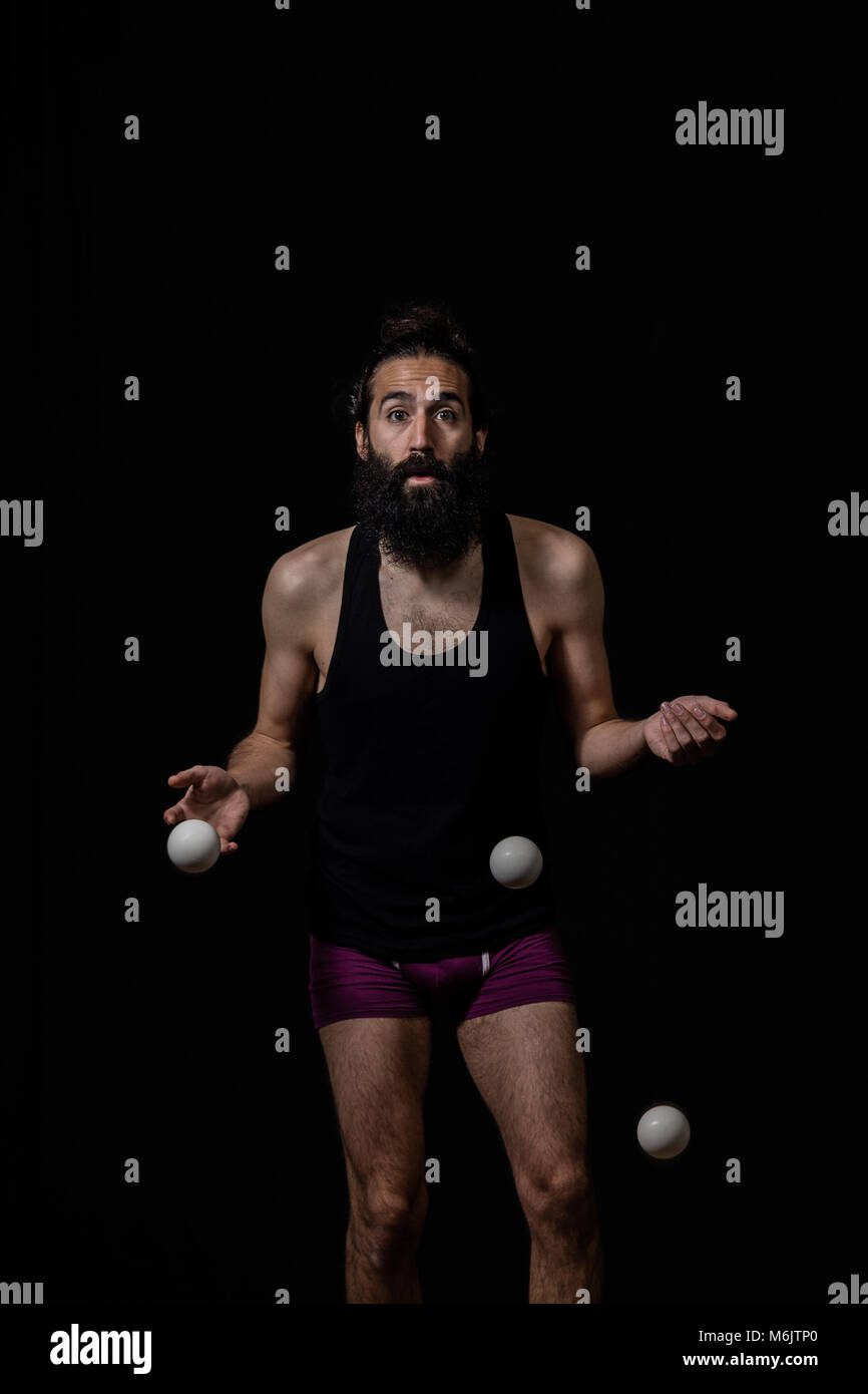 Juggler dropping his balls at the circus. Clumsy / inattention concept ...