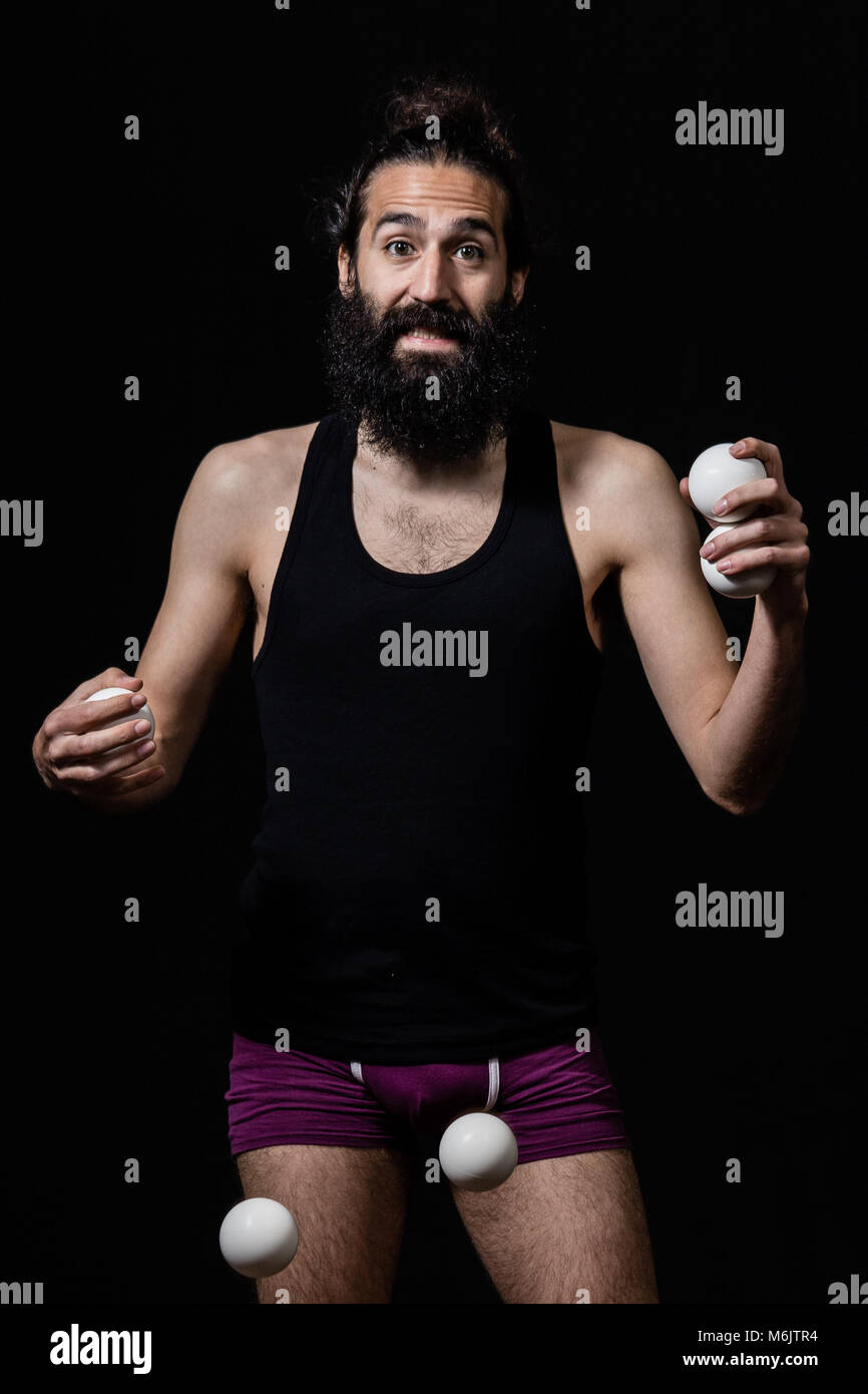 Juggler having fun making his performance at the circus Stock Photo - Alamy