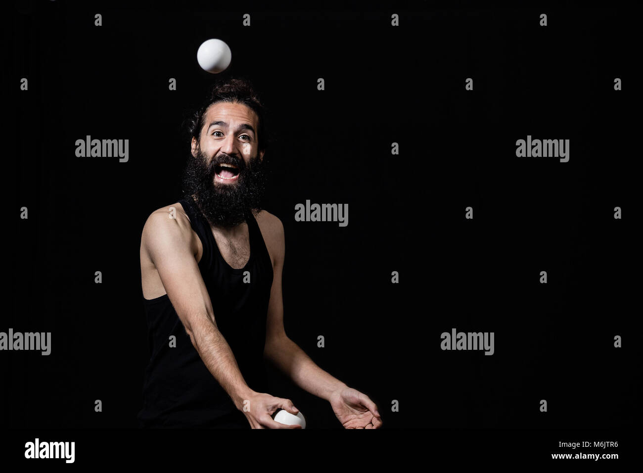 Juggler having fun making his performance at the circus Stock Photo - Alamy
