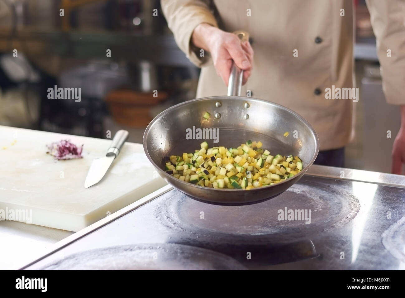 Chef Holding Frying Pan Stock Photos & Chef Holding Frying Pan Stock ...