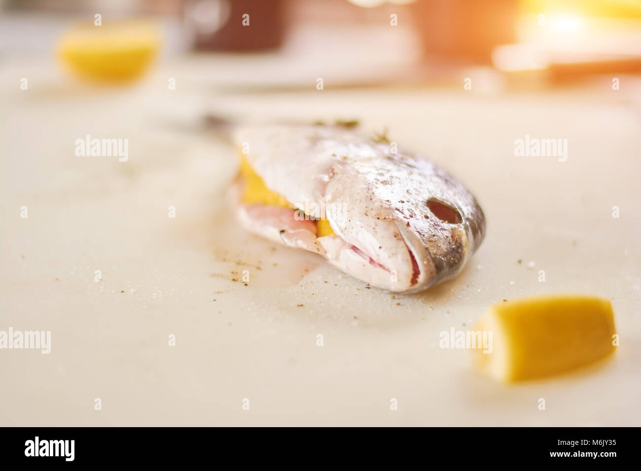 Raw fish on blurred background Stock Photo - Alamy