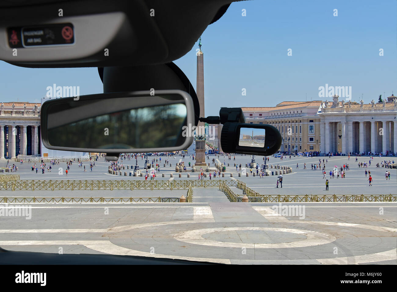 Looking through a dashcam car camera installed on a windshield with ...