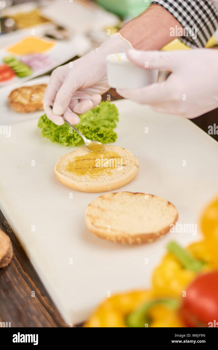 Chef cooking hamburger at professional kitchen Stock Photo - Alamy