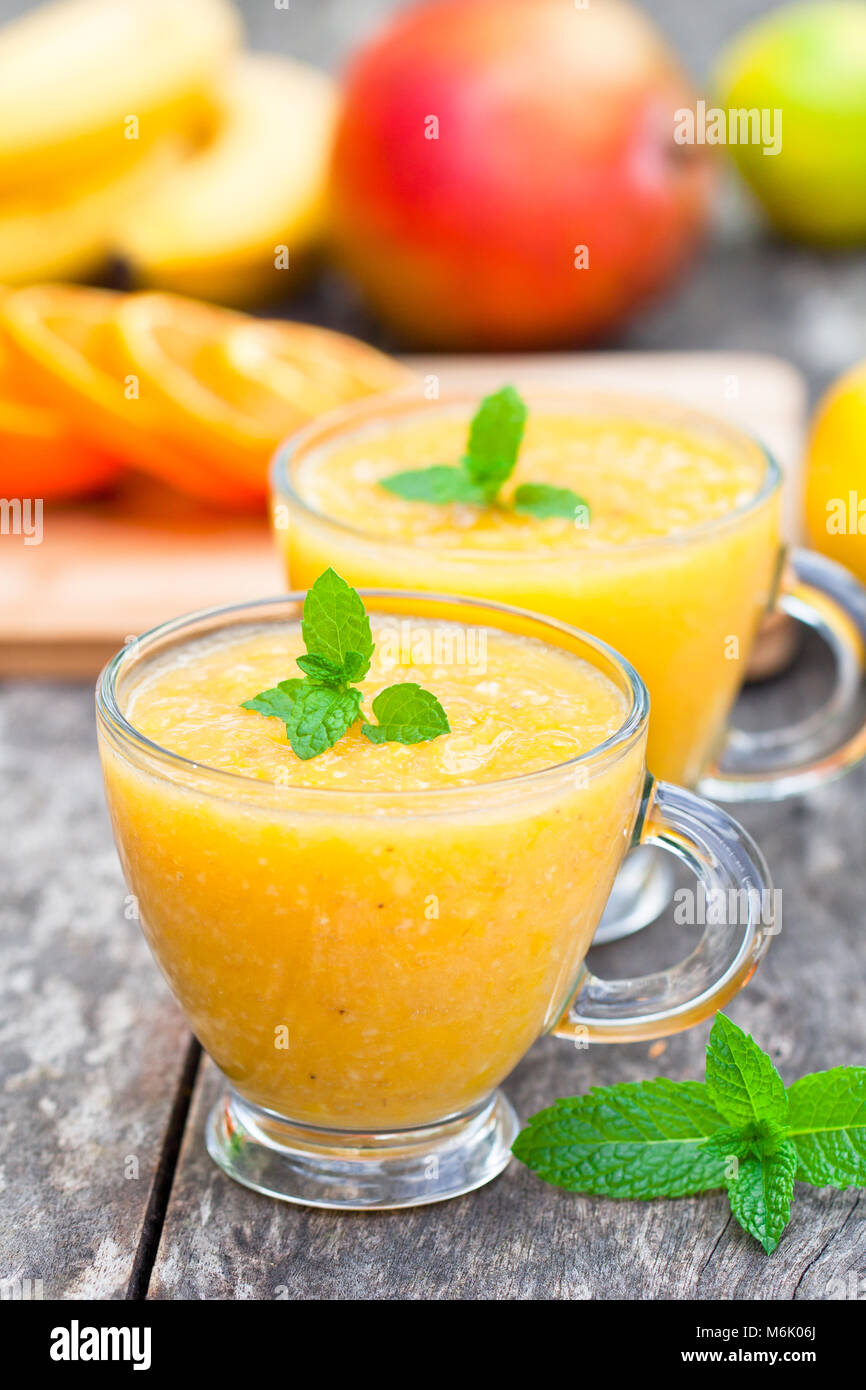 fresh healthy pulpy juice with orange fruits and vegetables Stock Photo ...