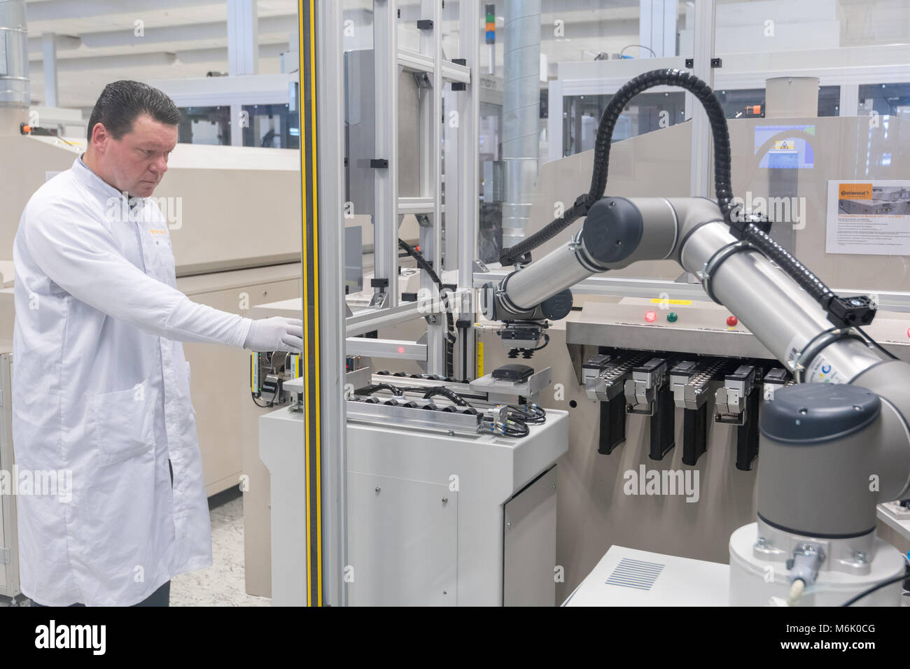02 March 2018, Germany, Ingolstadt: A worker checking the production of ...