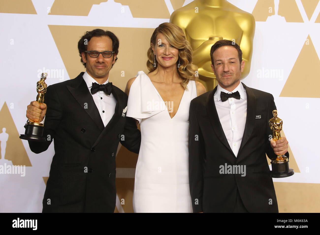 Los Angeles, Ca, USA. 4th Mar, 2018. Dan Cogan, Laura Dern and Bryan ...