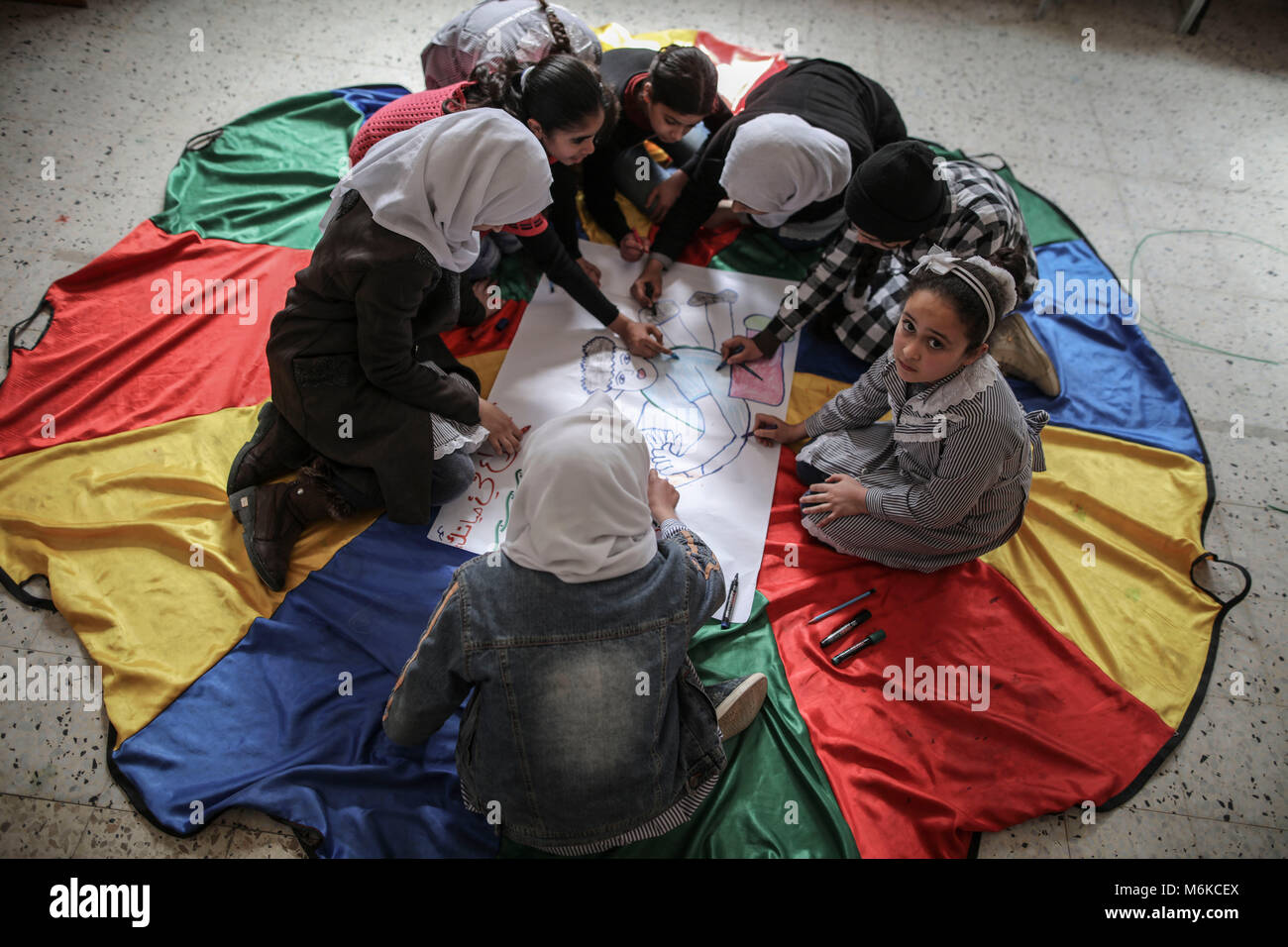 Palestinian children attend a psychological release session battling ...