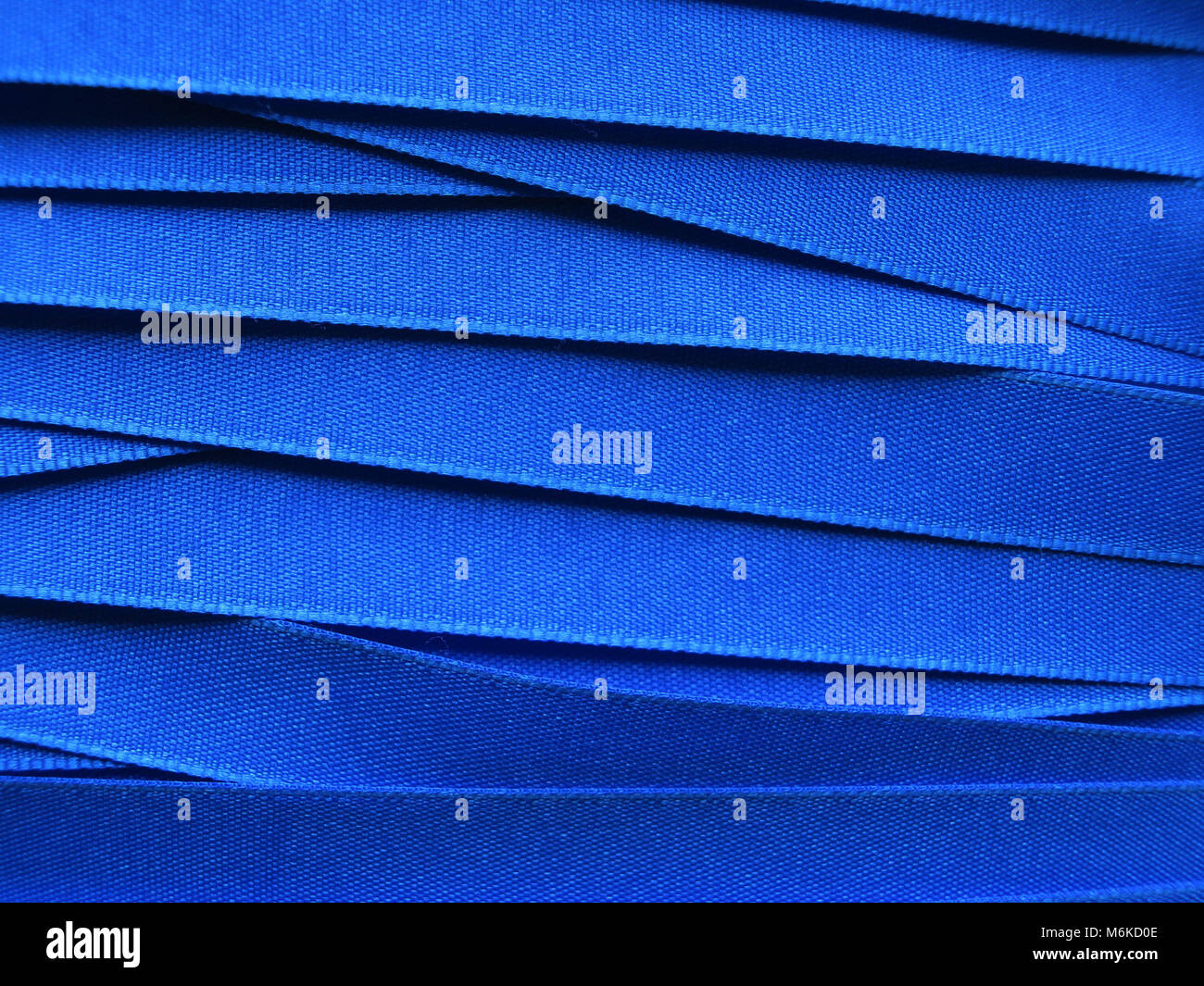 Shiny blue satin ribbon background Stock Photo - Alamy