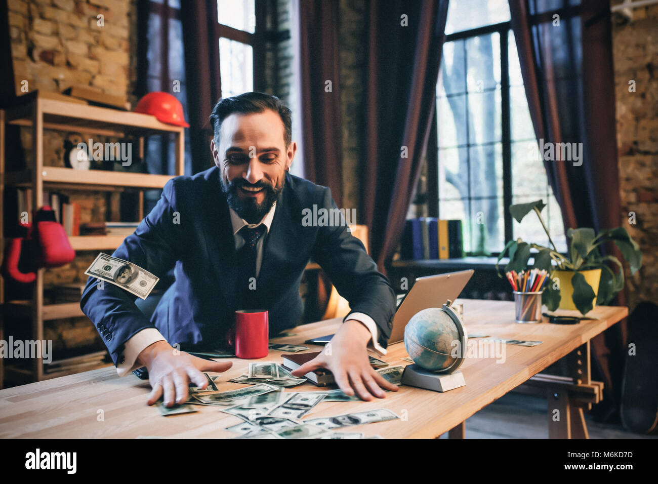 Rich Businessman At Desk