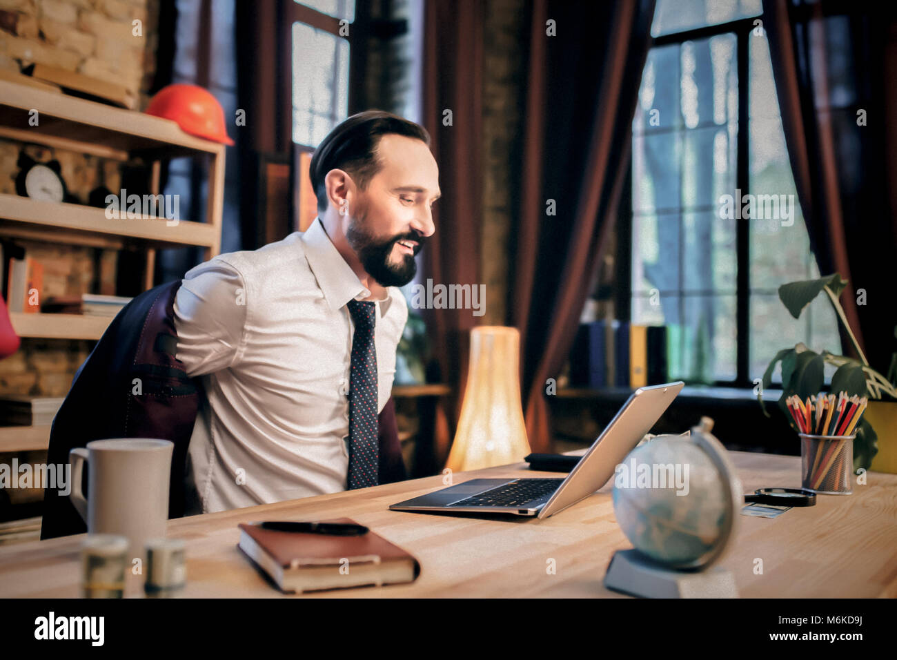 businessman in a strange position Stock Photo - Alamy
