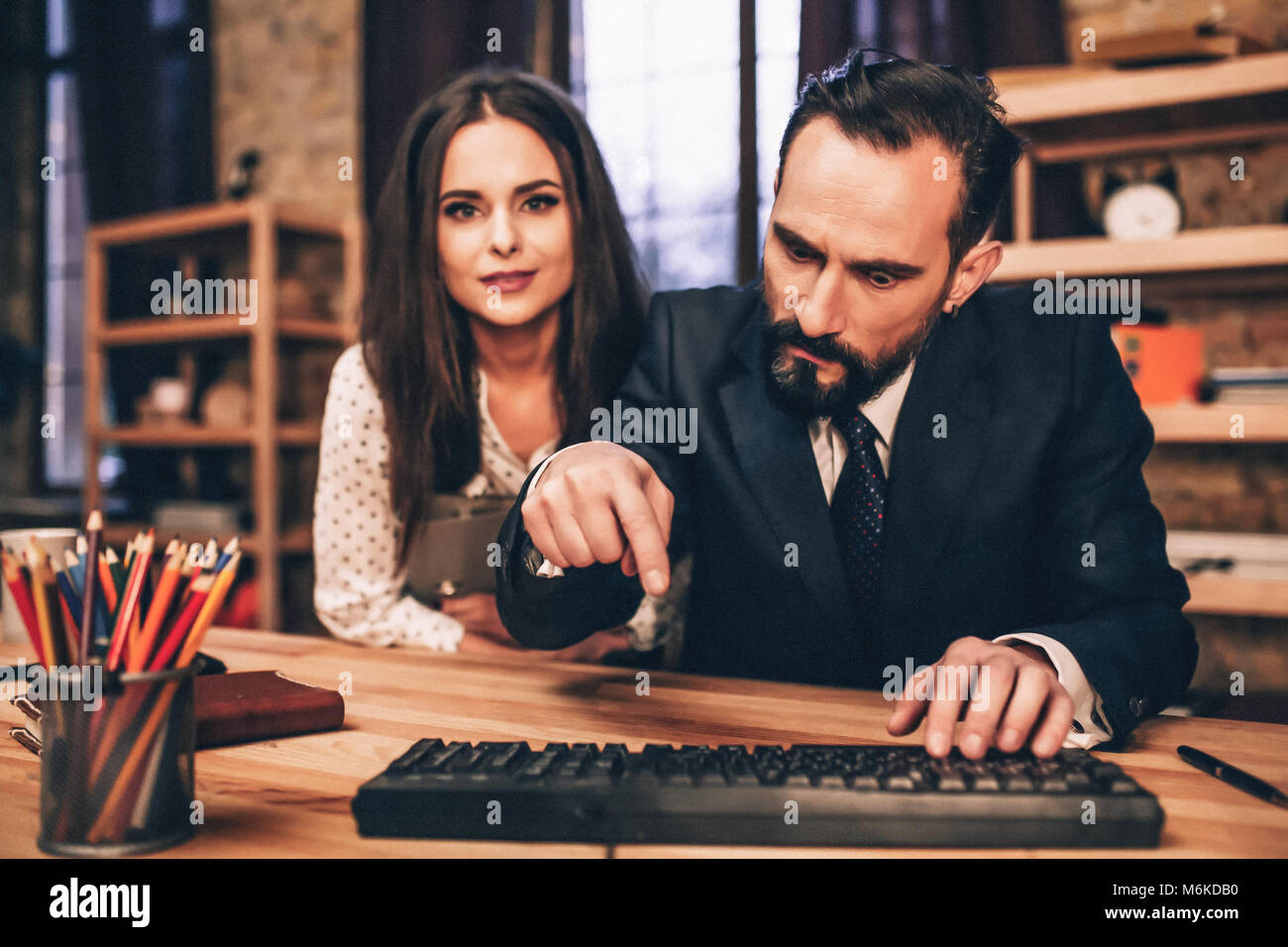 Business people working on project in office Stock Photo - Alamy