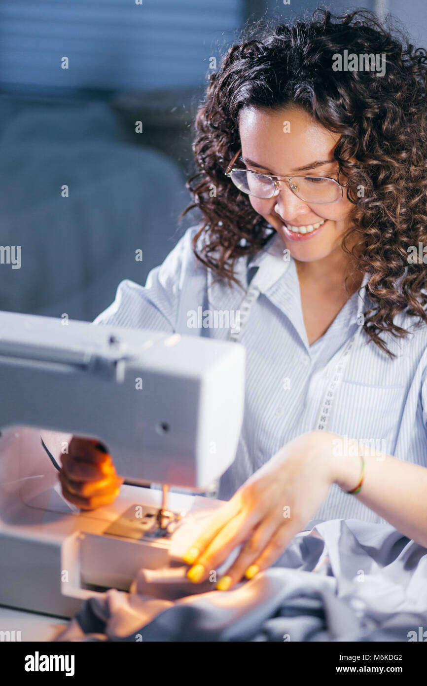 Sewing together two fabric hi-res stock photography and images - Alamy