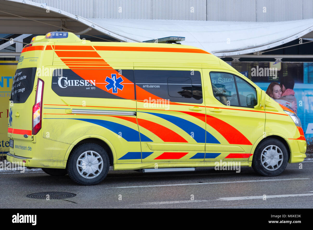 SALZBURG, AUSTRIA - March 03, 2018: Austrian yellow Ambulance near the ...