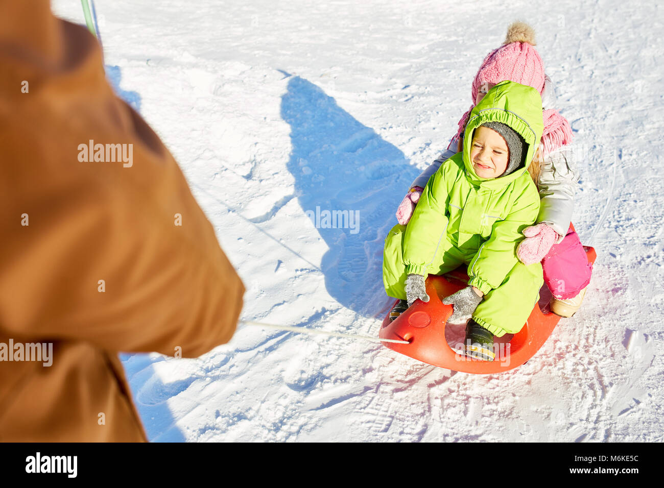 Little kids on sled ride Stock Photo - Alamy