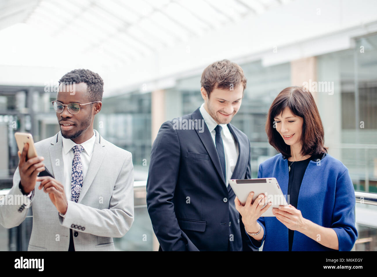 Business people using digital tablet on meeting Stock Photo - Alamy