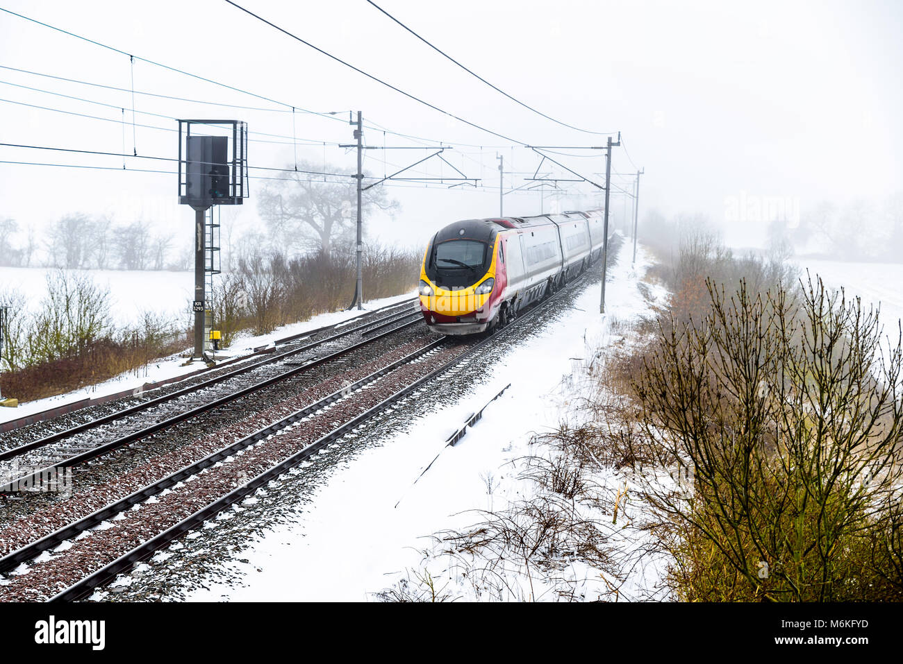 Cloudy foggy winter day view of Train on UK Railroad in England. Emma ...