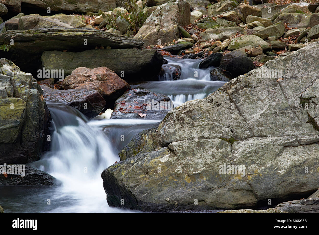 Rocky stream with small water falls Stock Photo - Alamy