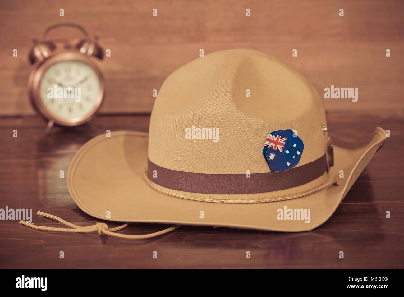 Anzac army slouch hat with Australian Flag on vintage wood background ...