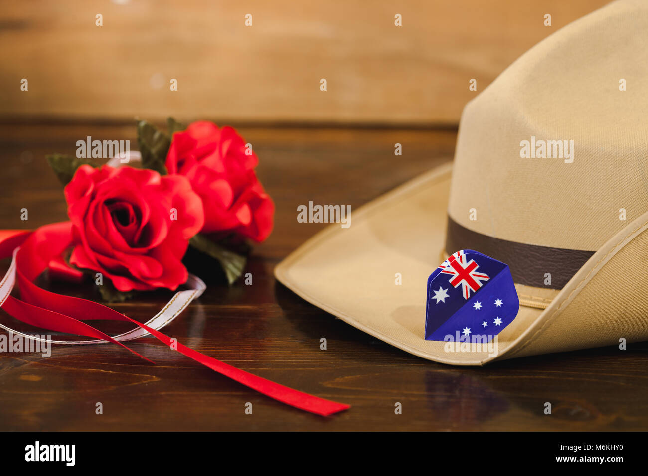 Anzac army slouch hat with red flower on vintage wood background Stock ...