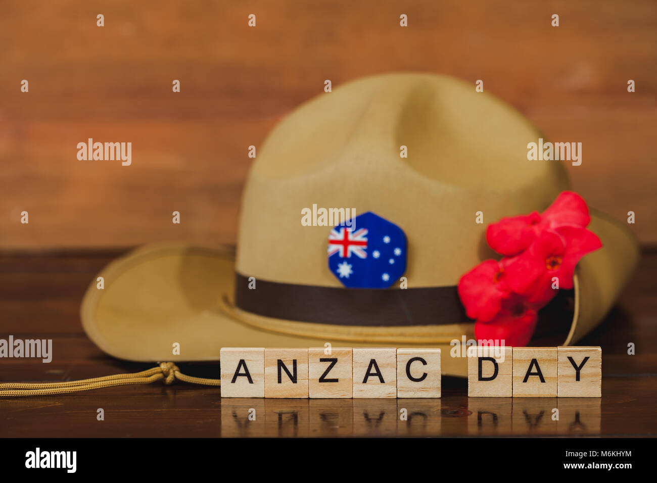 Anzac army slouch hat with Australian Flag on vintage wood background ...