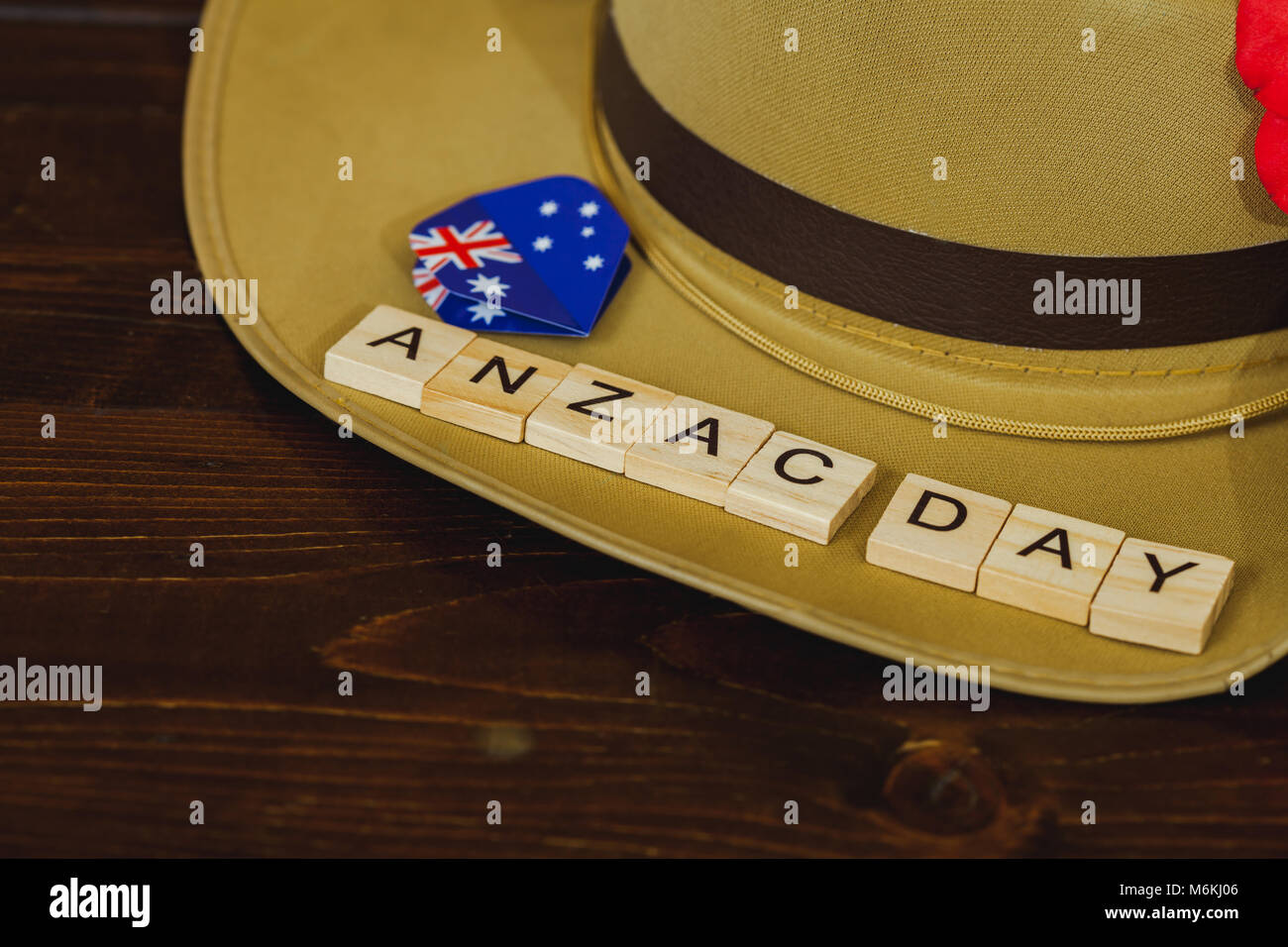 Anzac army slouch hat with Australian Flag on vintage wood background ...
