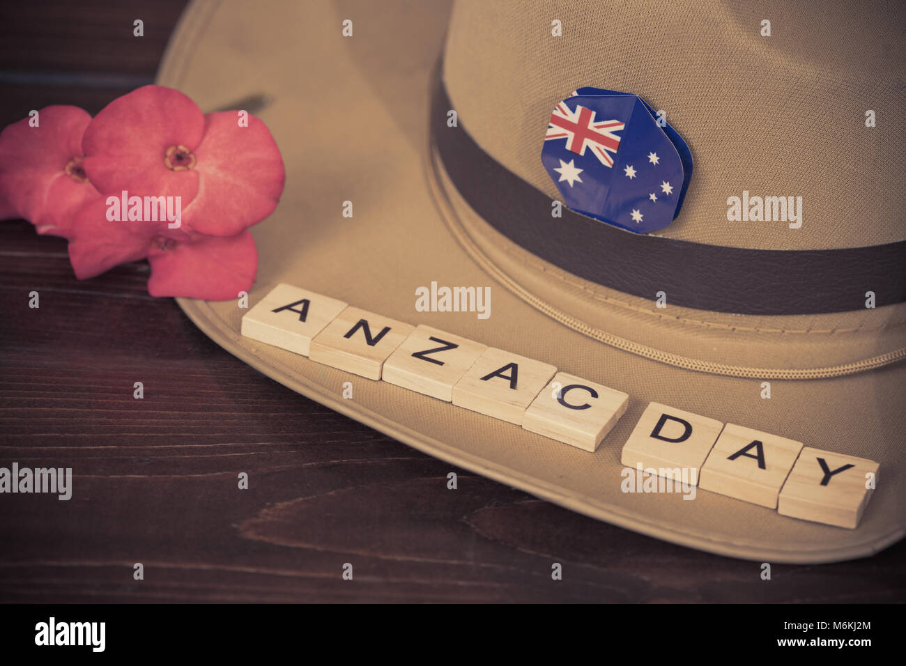 Anzac army slouch hat with Australian Flag on vintage wood background ...