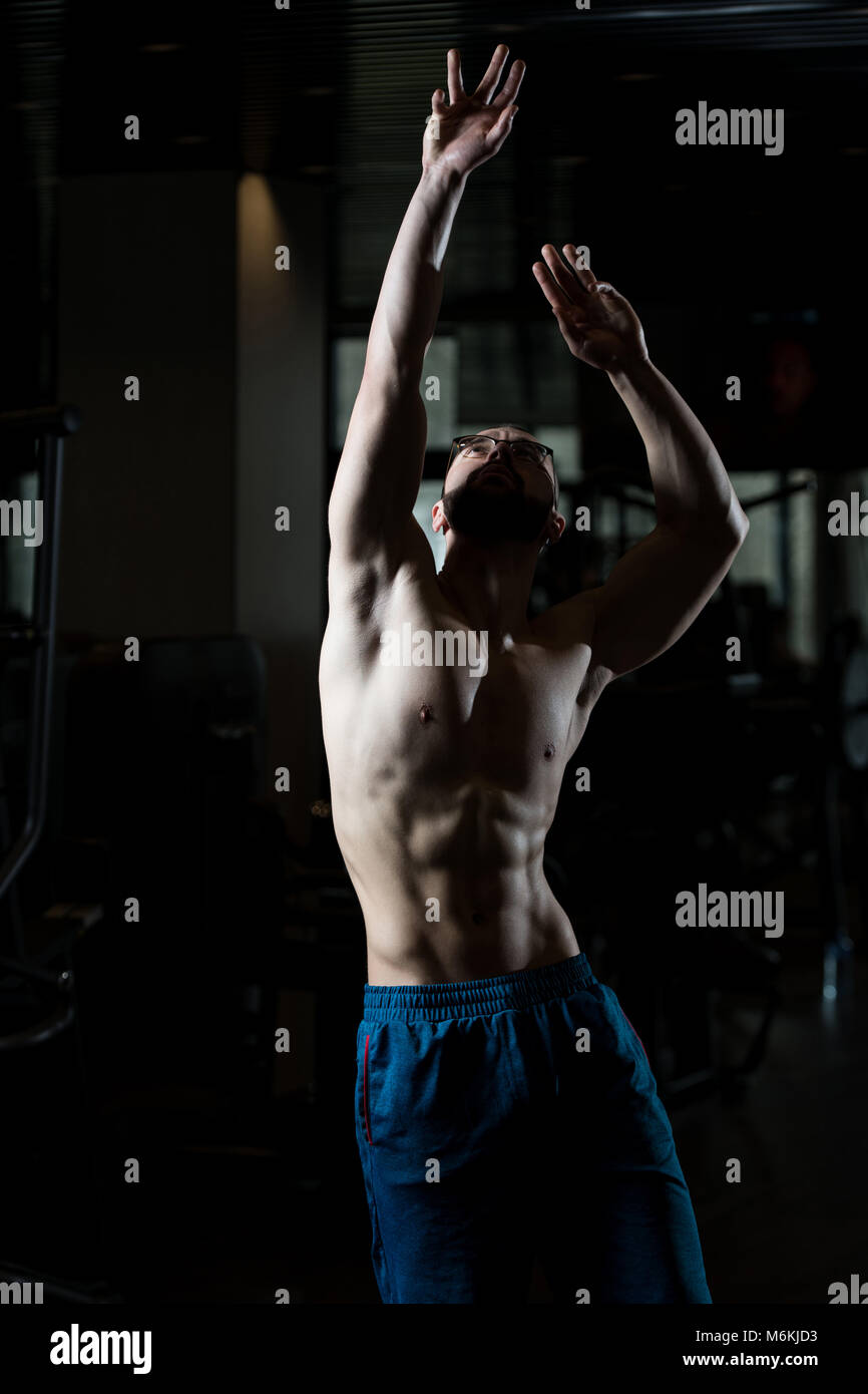 Portrait Of A Young Physically Fit Nerd Man Showing His Well Trained ...