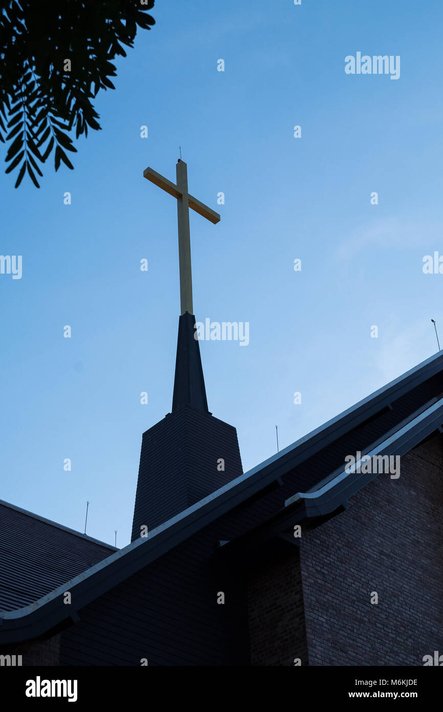 cross on top of roof with a blue sky Stock Photo - Alamy