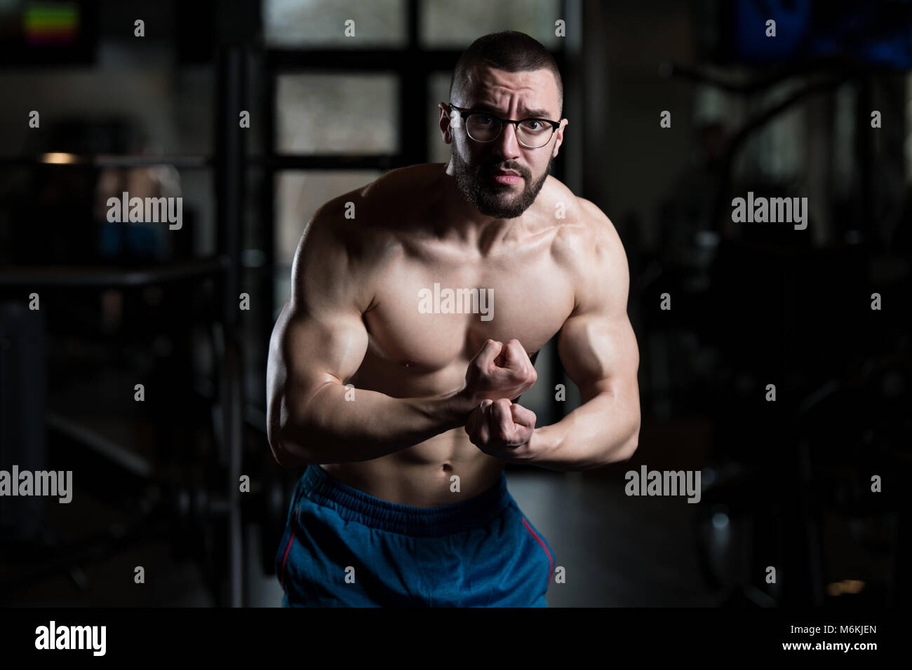 Geek flexing muscles hi-res stock photography and images - Alamy