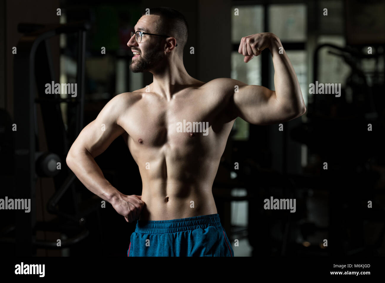Geek flexing muscles hi-res stock photography and images - Alamy