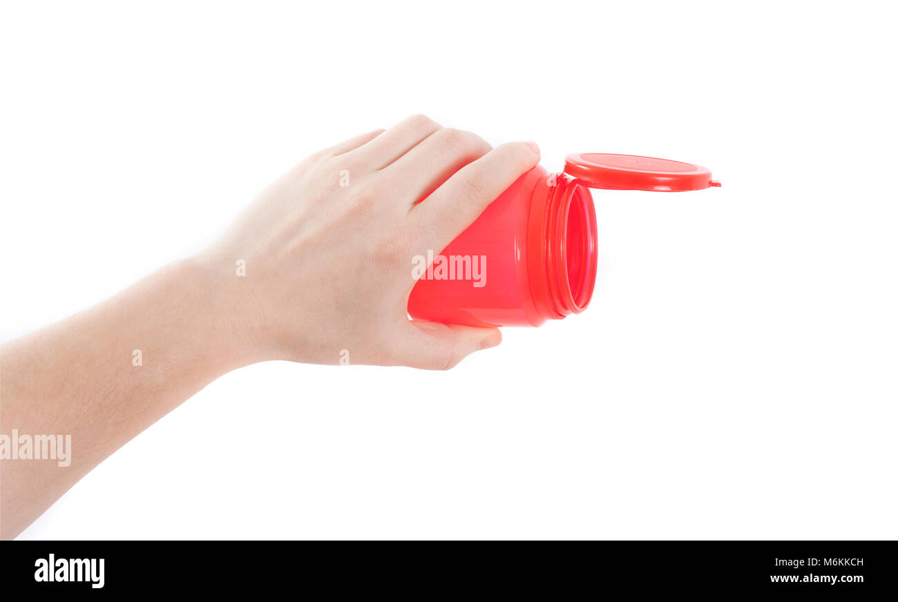 hand holding empty red can or bottle for pouring concept. isolated on ...