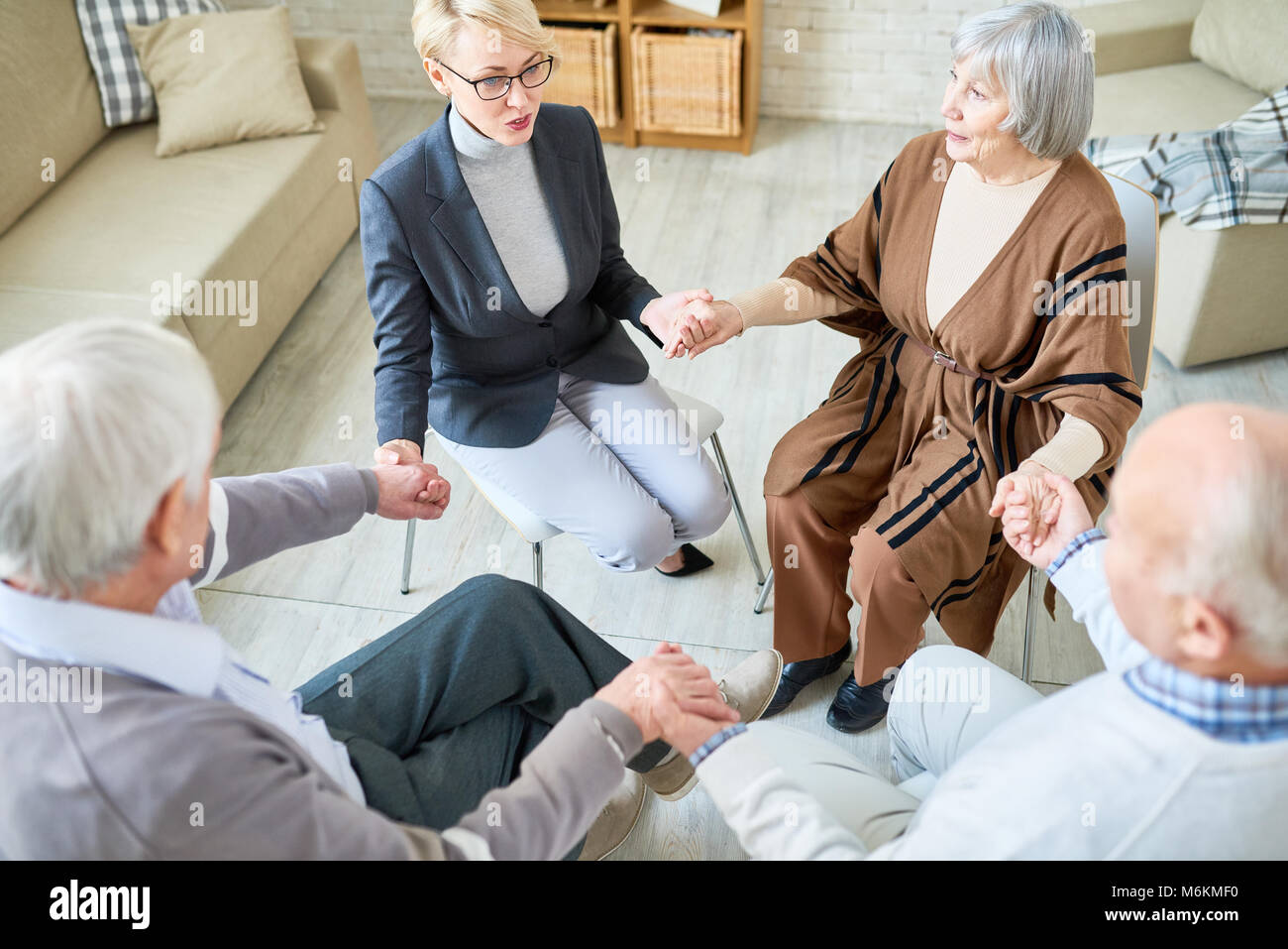 Support Circle in Group Therapy Session Stock Photo - Alamy